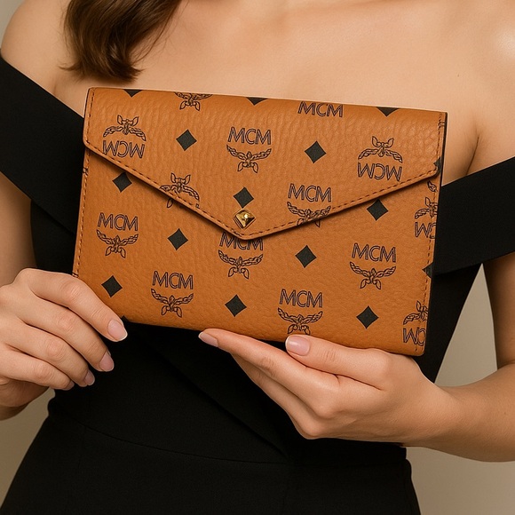 MCM | Bags | Luxury Cognac Monogram Envelope Pouch Slim Travel Clutch ...